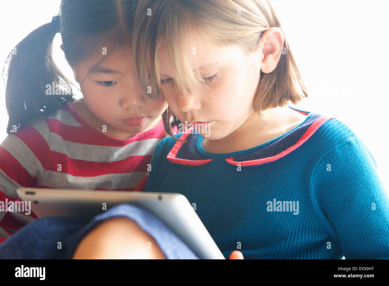 Asian kids with ipad hi-res stock photography and images - Alamy