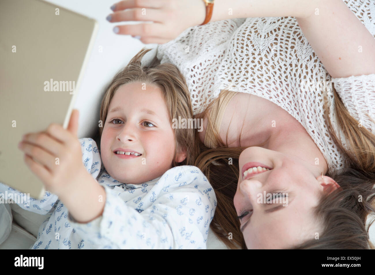 Teen boy holding up tablet hi-res stock photography and images - Alamy