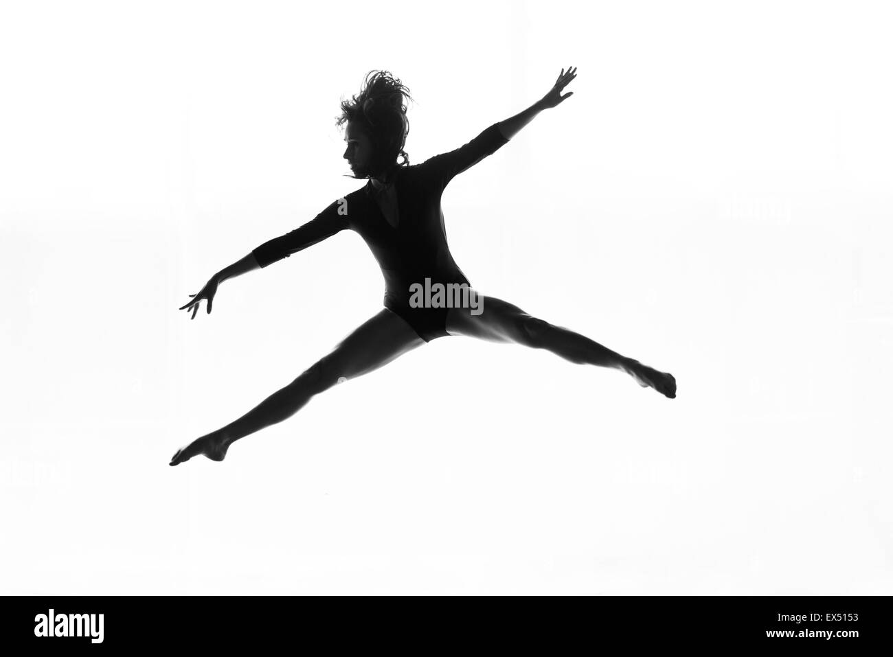 Female silhouette arms outstretched jumping hi-res stock photography and images - Alamy