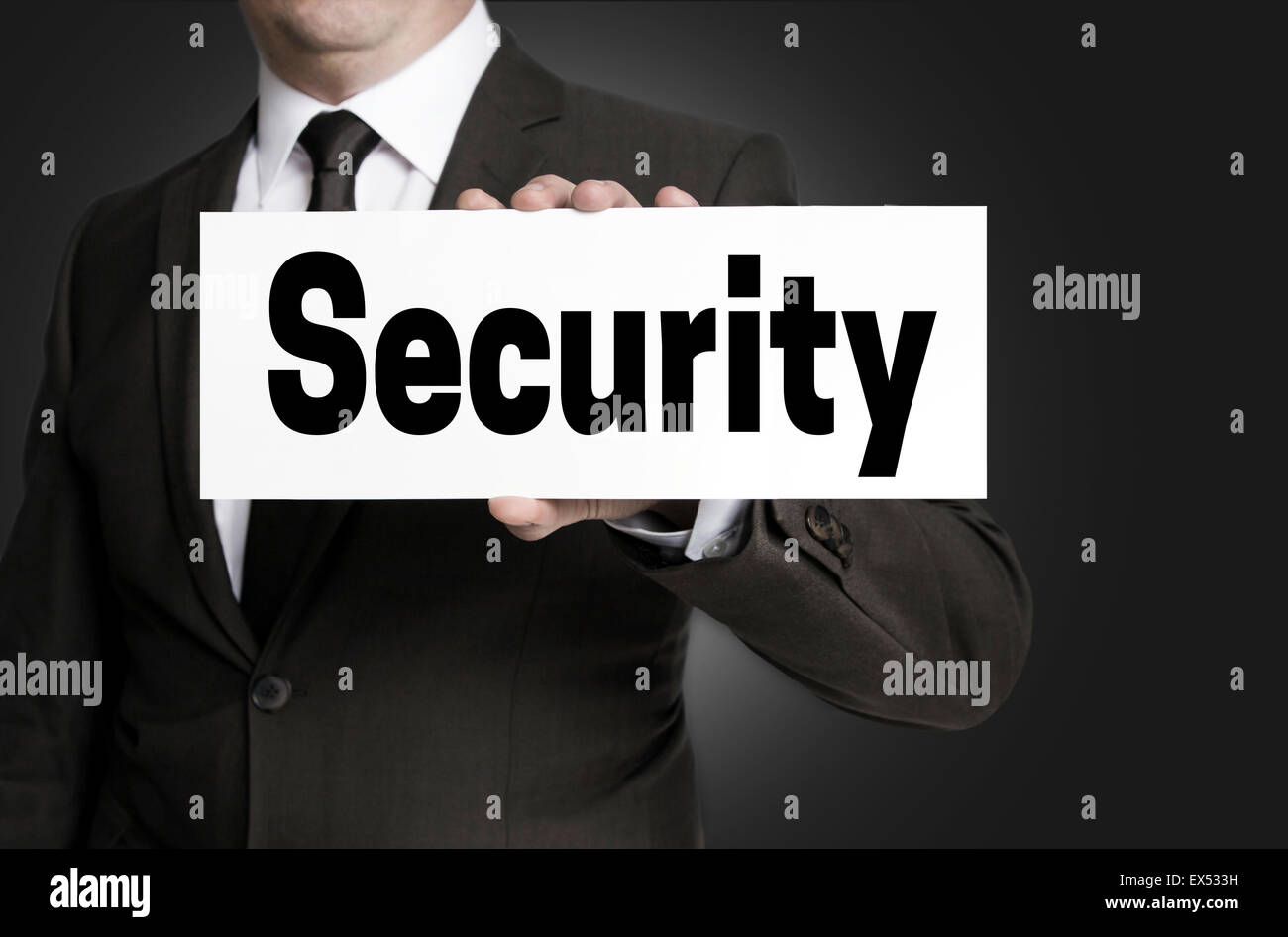 Security sign is held by businessman Stock Photo - Alamy