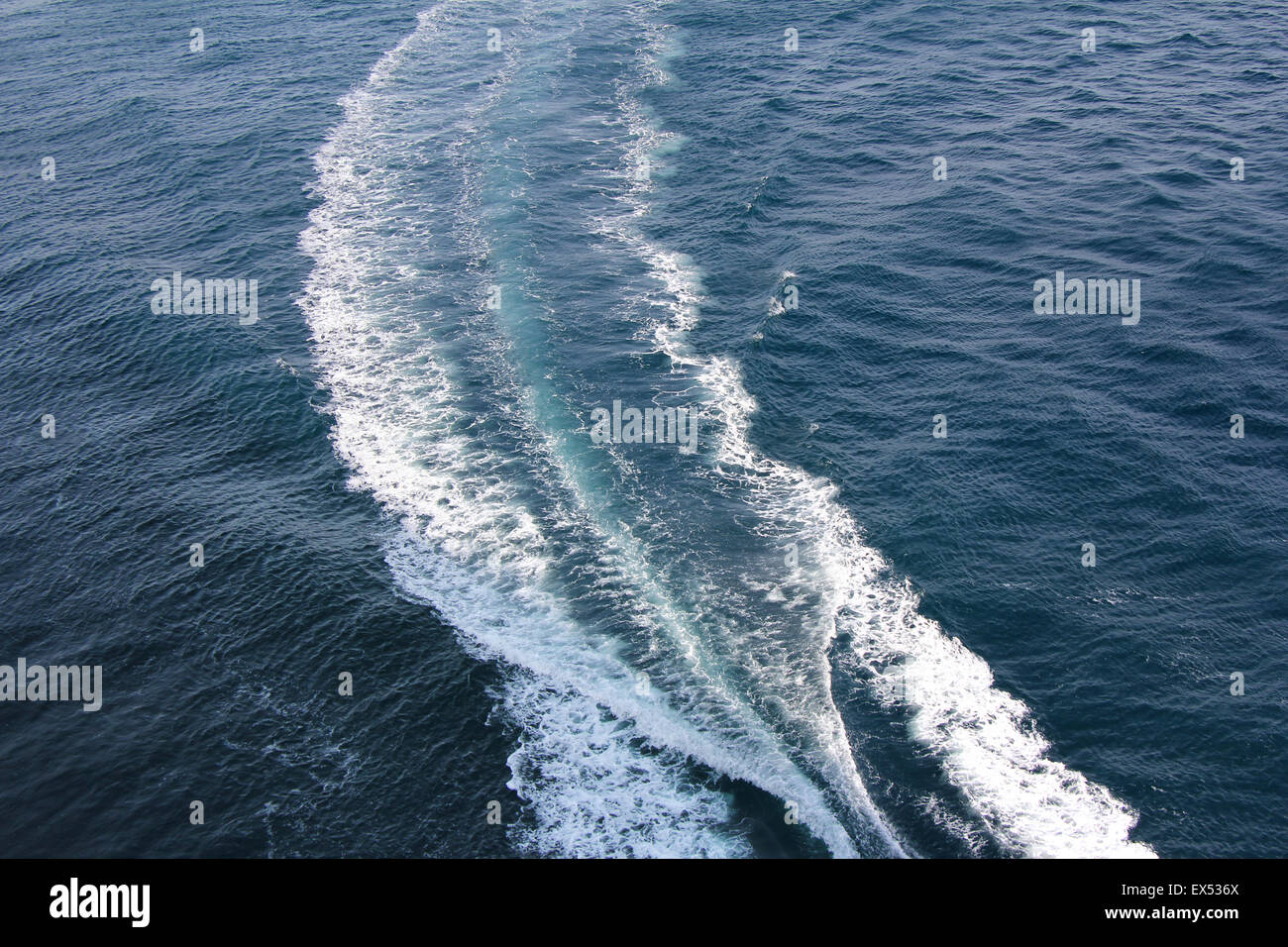 Speed boats trace on the blue sea Stock Photo - Alamy