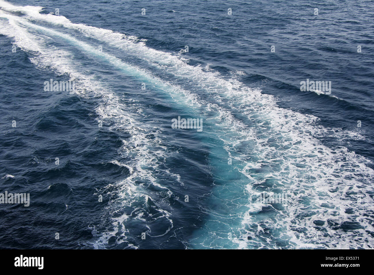 Speed boats trace on the blue sea Stock Photo - Alamy