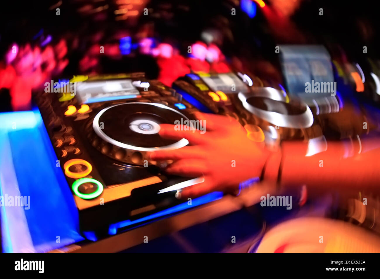Atmospheric motion image of a DJ's hand playing mysic on the decks ...