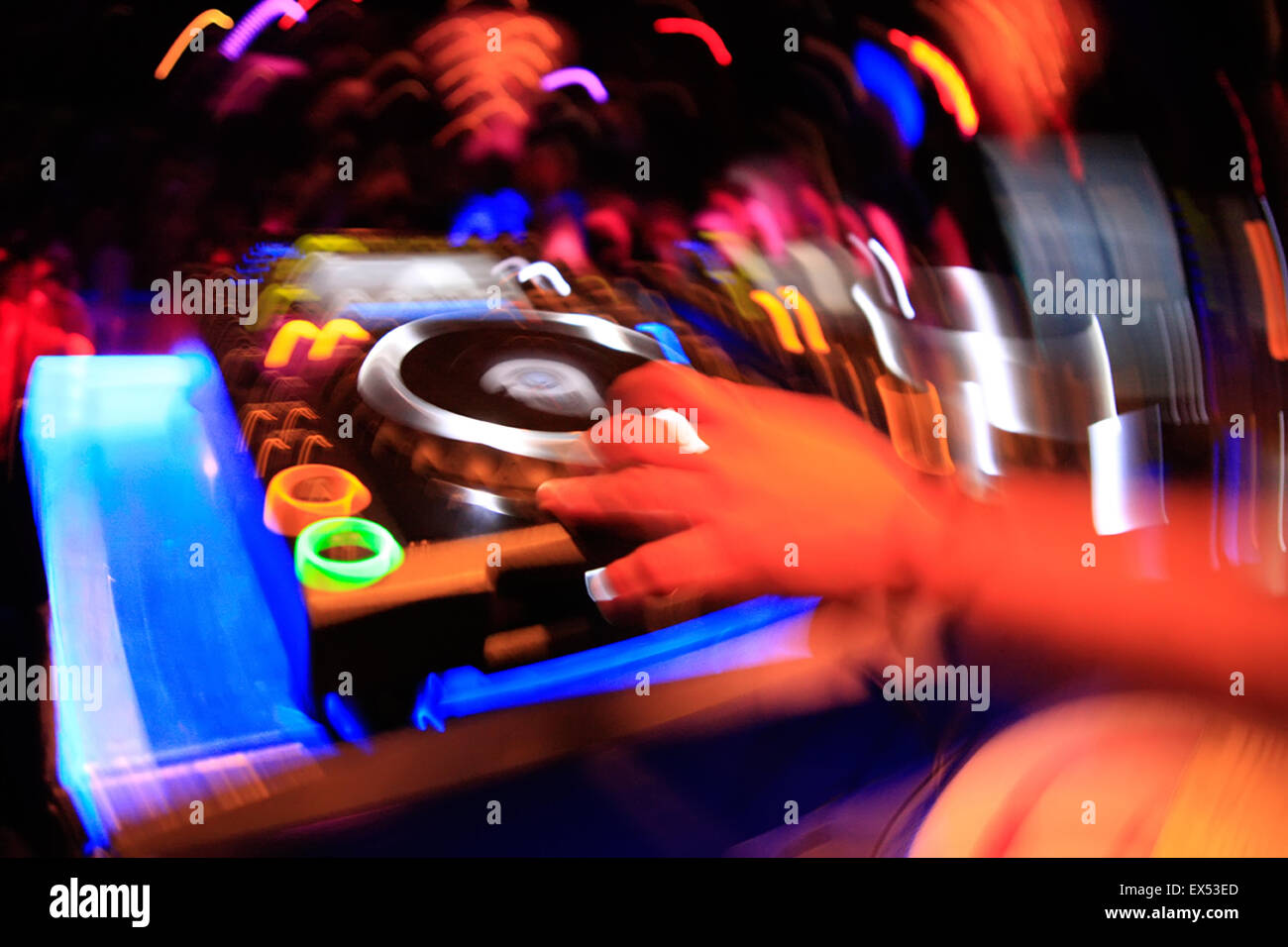 Motion image of a DJ's hand playing mysic on the decks / sound mixing ...