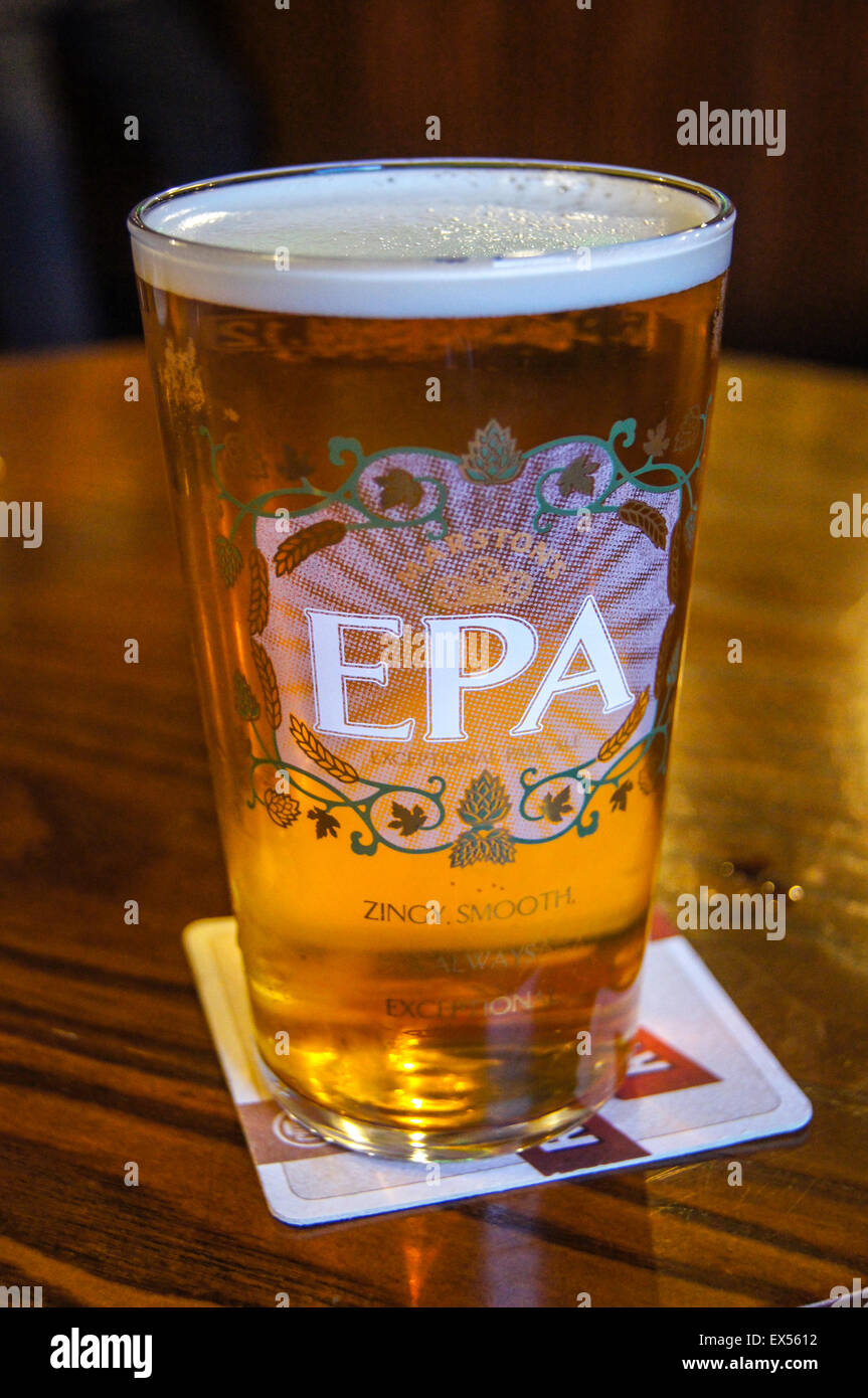 A pint of Marston's EPA real ale on a beermat pub table drinks glasses ...
