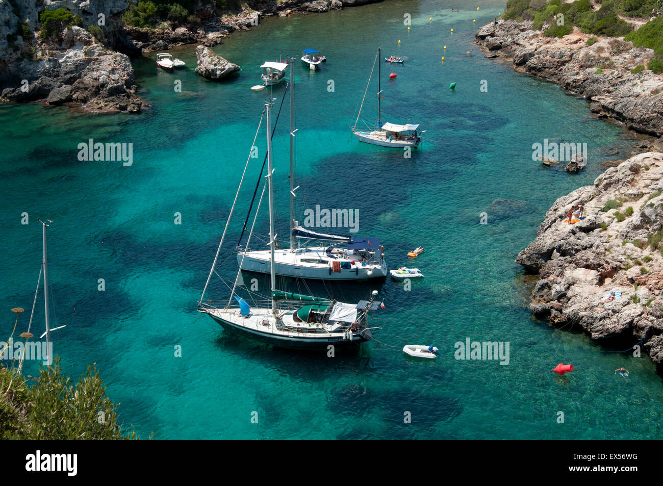 Sailing yachts moored in the secluded rocky cove of Calas Coves on the ...