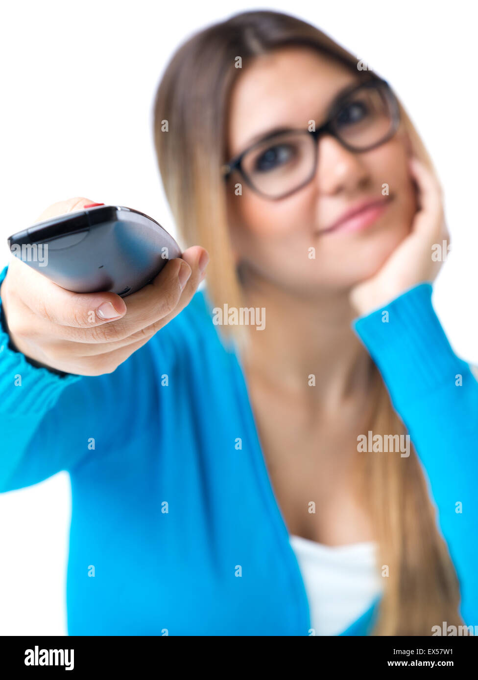 Portrait of young beautiful girl turning on the TV. Isolated on white ...