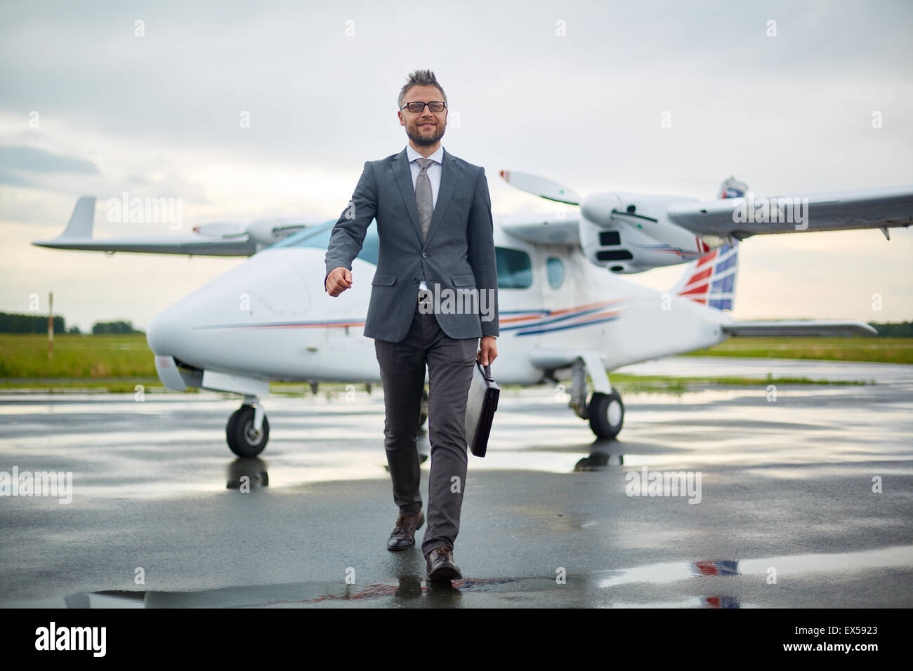 Modern businessman arrived by airplane for meeting with foreign ...