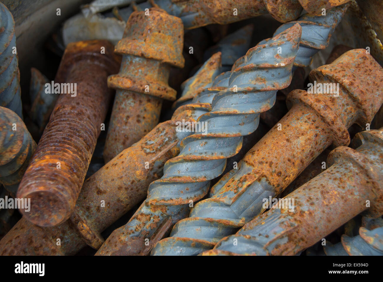 A bucket full of rusty old rail screw spikes or track spikes. Items of ...