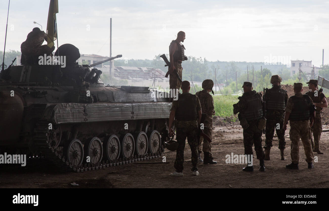 The commander of a Ukrainian BTR-2 Armored Fighting Vehicle briefs his ...