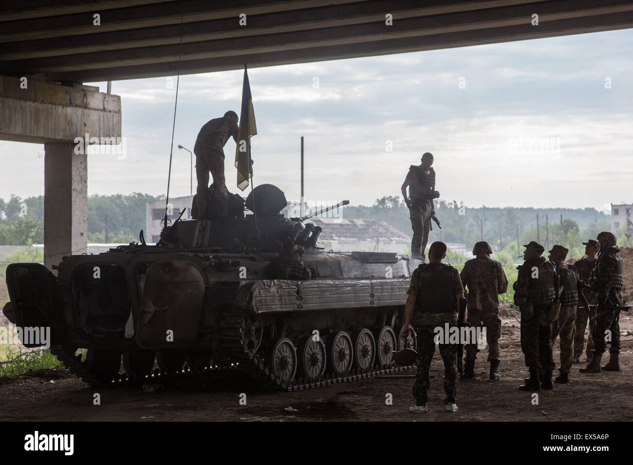 The commander of a Ukrainian BTR-2 Armored Fighting Vehicle briefs his ...