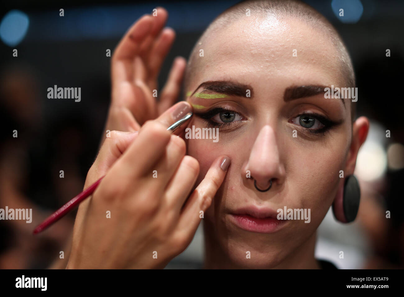 Berlin, Germany. 7th July, 2015. A model prepares for the show of ...