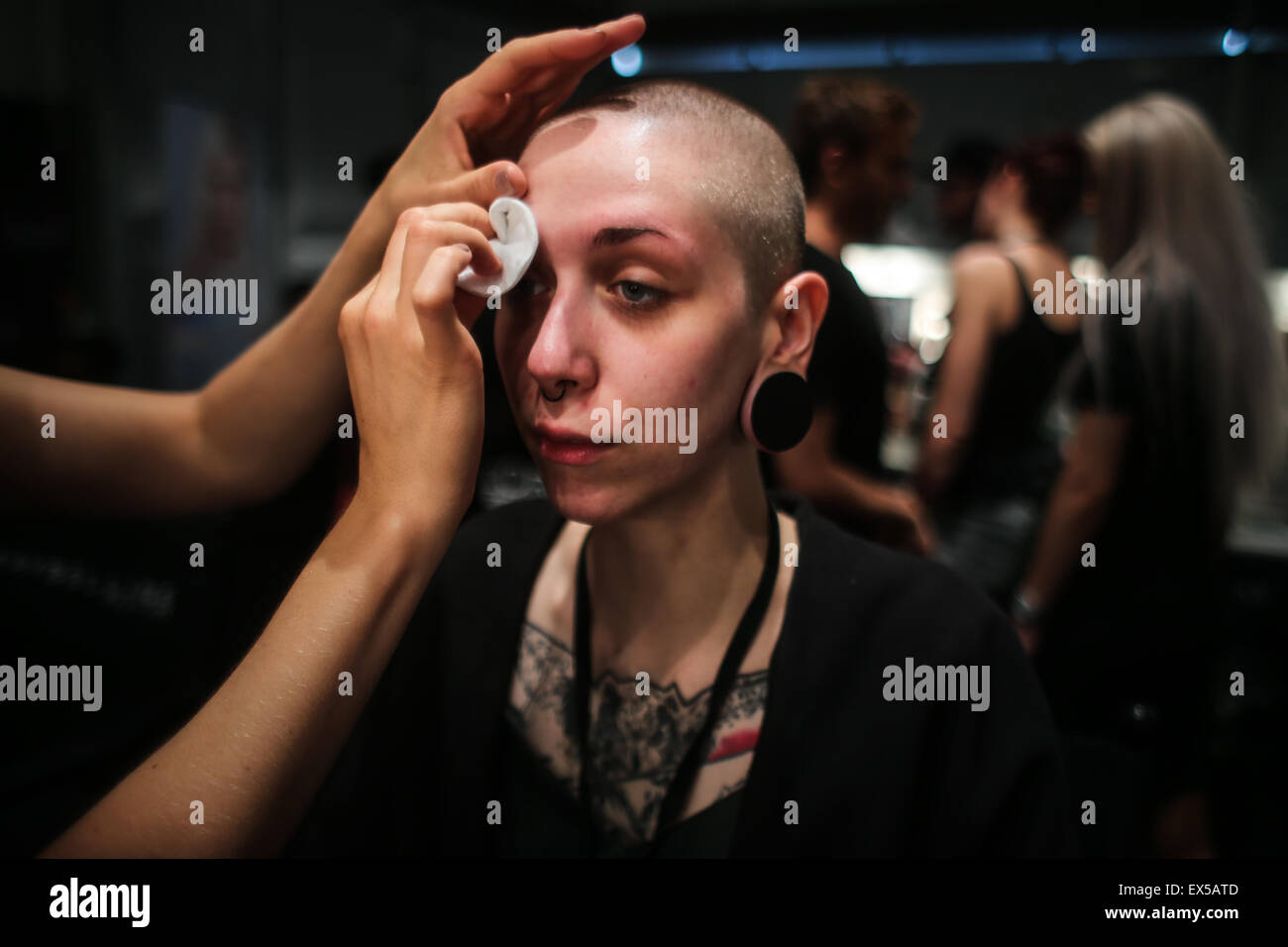 Berlin, Germany. 7th July, 2015. A model prepares for the show of ...