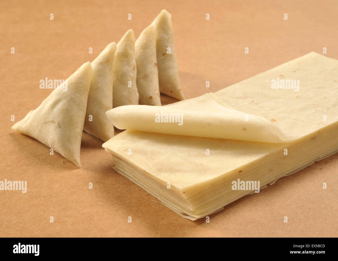Uncooked Samosa and Samosa Sheets Stock Photo - Alamy