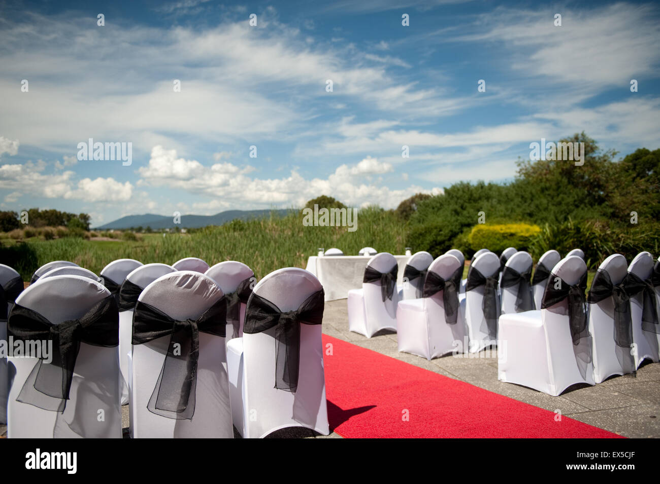 Chairs set up at an outdoor wedding ceremony Stock Photo - Alamy