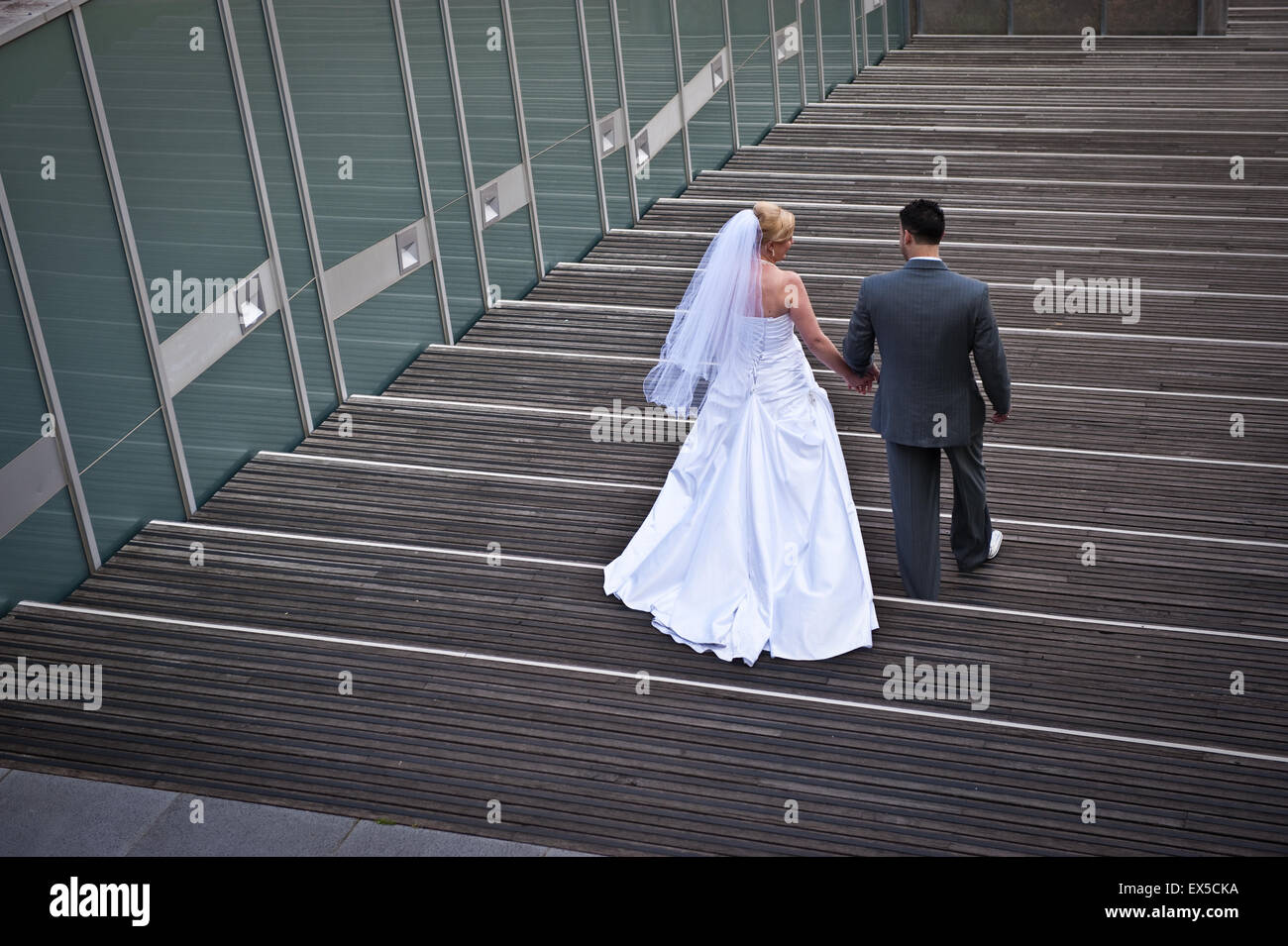 Married wedding couple walking away hi-res stock photography and images ...