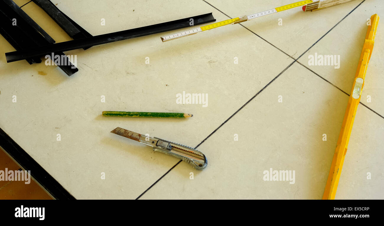 level, utility knife, strips, eec. tools work for a floating floor on ...