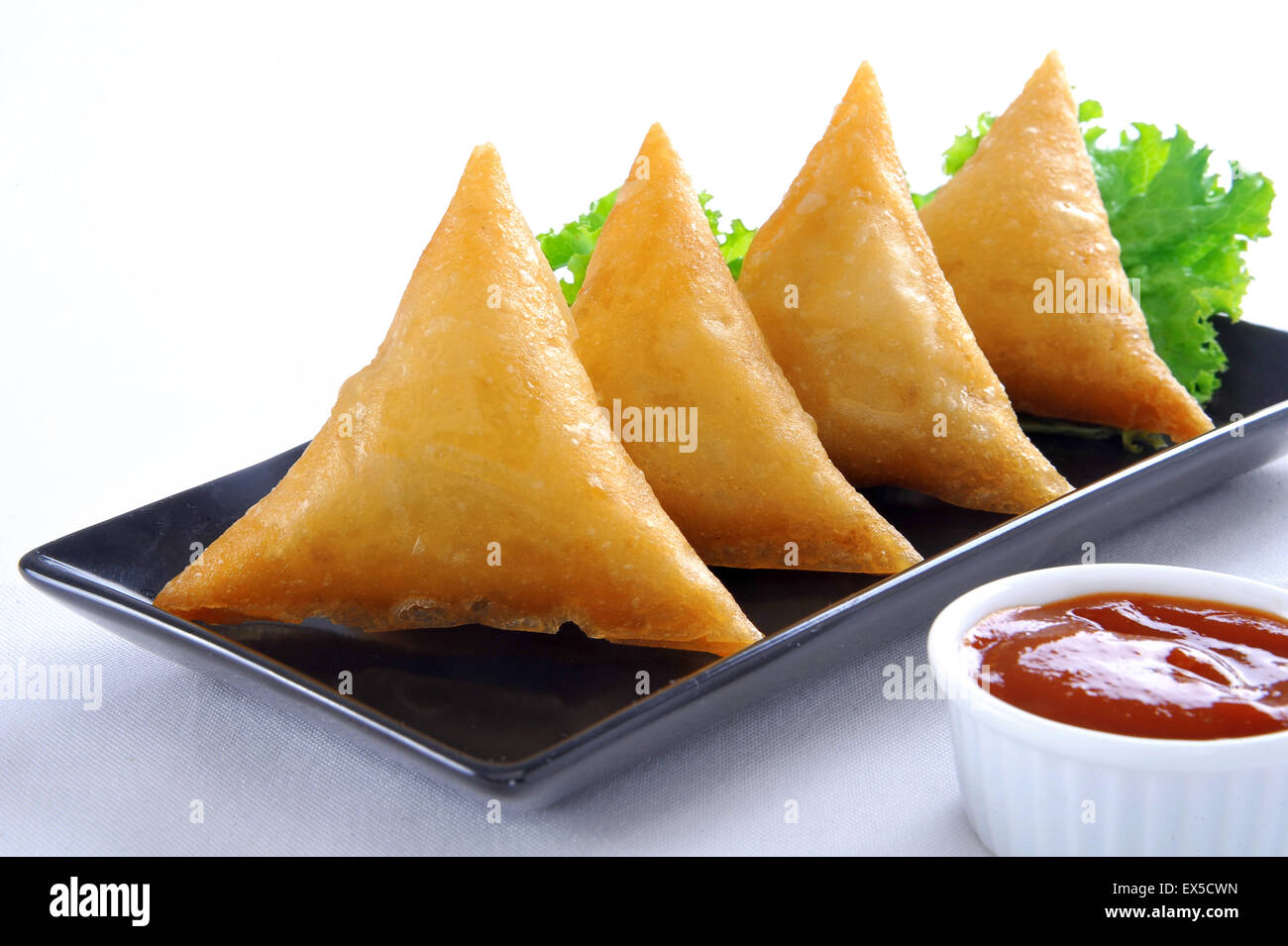 Beef Samosa in Black Dish Stock Photo - Alamy