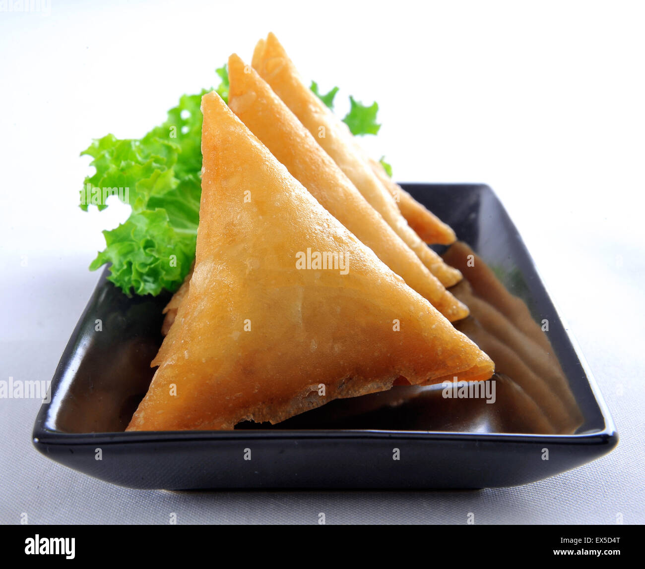 Beef Samosa in Black Dish Stock Photo - Alamy