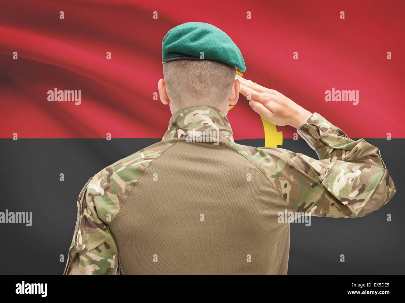 Soldier in hat facing national flag series - Angola Stock Photo - Alamy