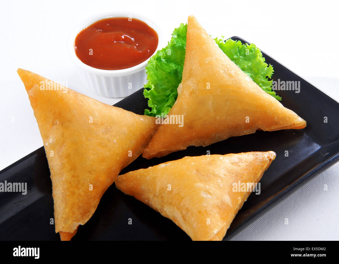 Beef Samosa in Black Dish Stock Photo - Alamy