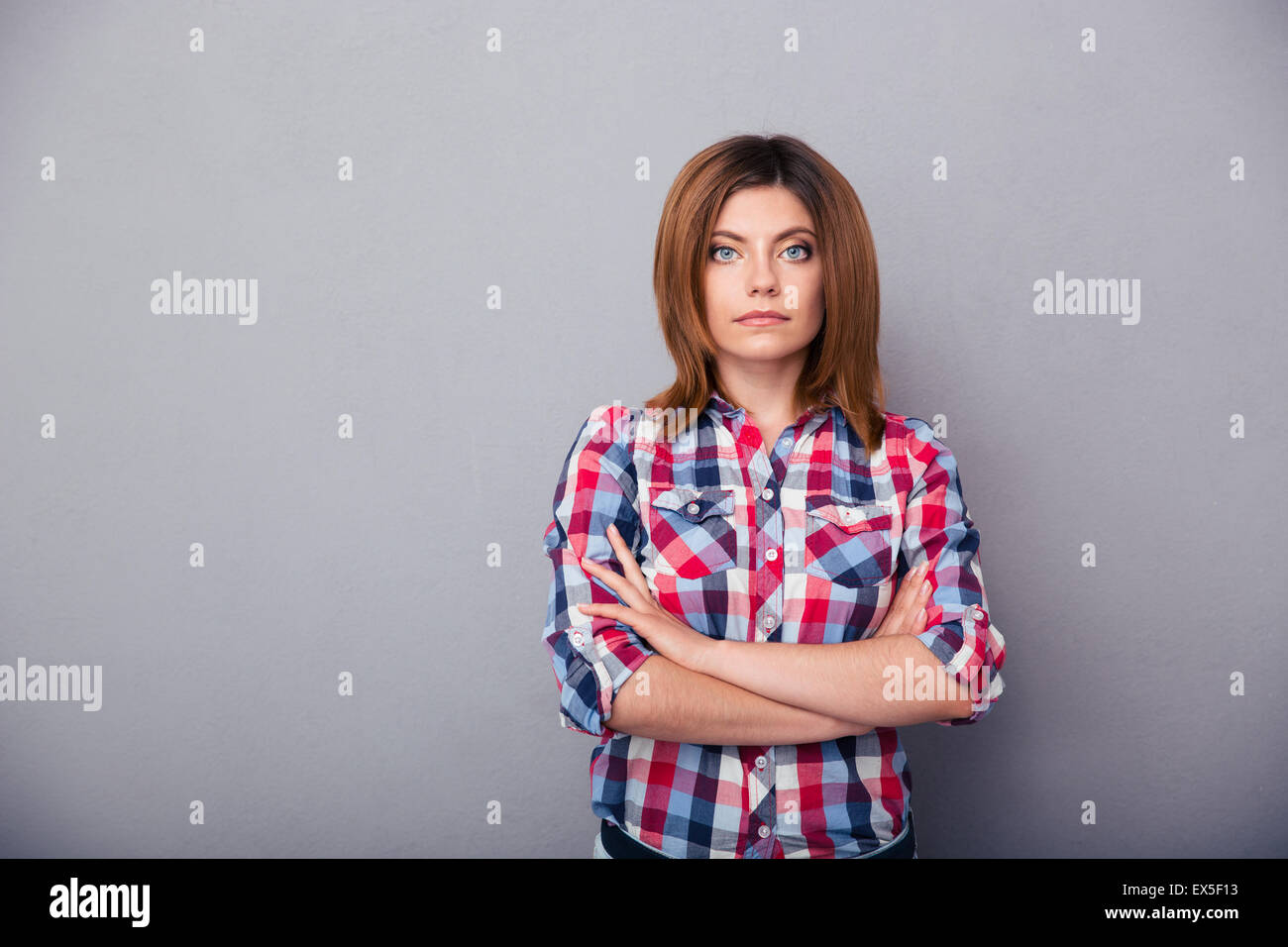 Beautiful woman standing folded hi-res stock photography and images - Alamy