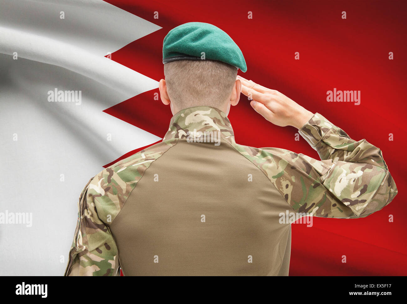 Soldier in hat facing national flag series - Bahrain Stock Photo - Alamy