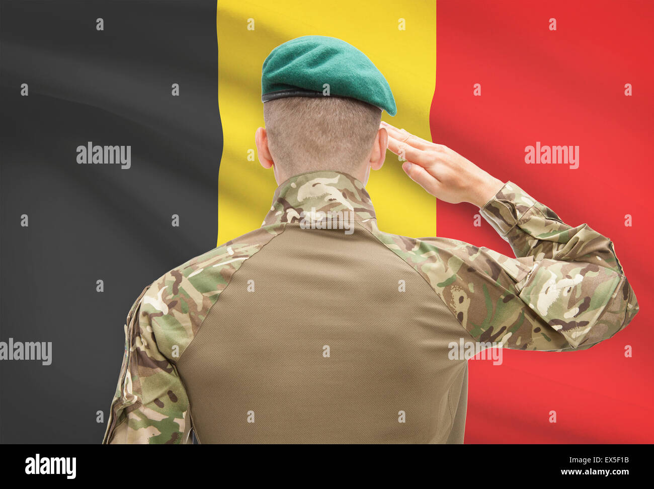 Soldier in hat facing national flag series - Belgium Stock Photo - Alamy