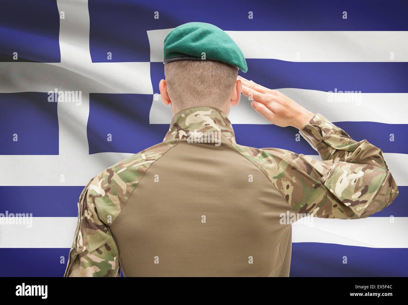 Soldier in hat facing national flag series - Greece Stock Photo - Alamy