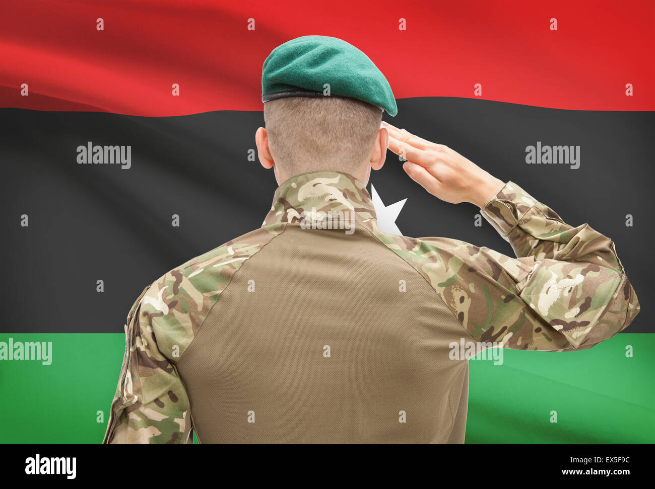 Soldier in hat facing national flag series - Libya Stock Photo - Alamy