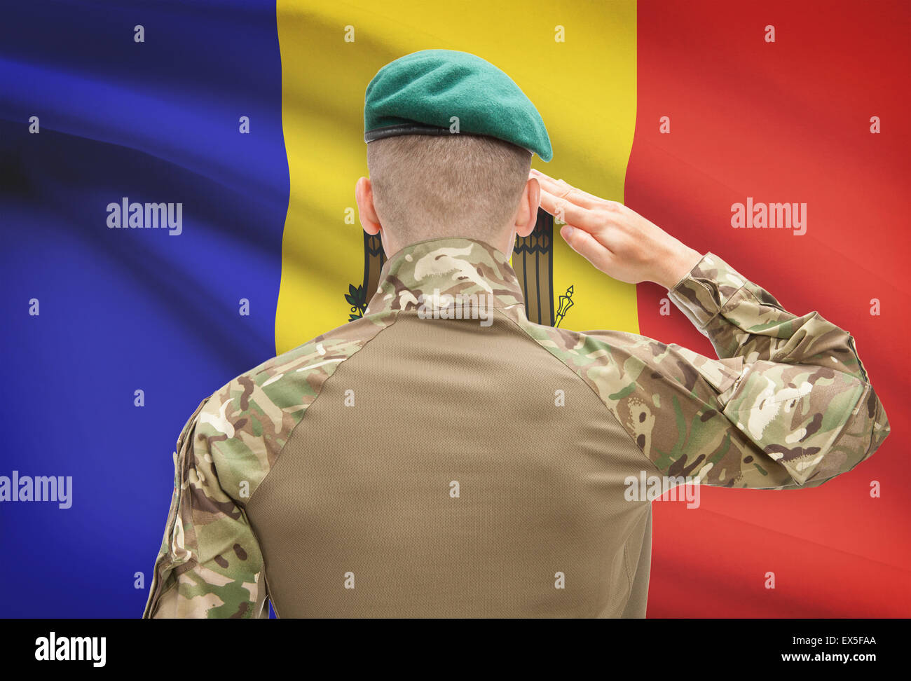 Soldier in hat facing national flag series - Moldova Stock Photo - Alamy