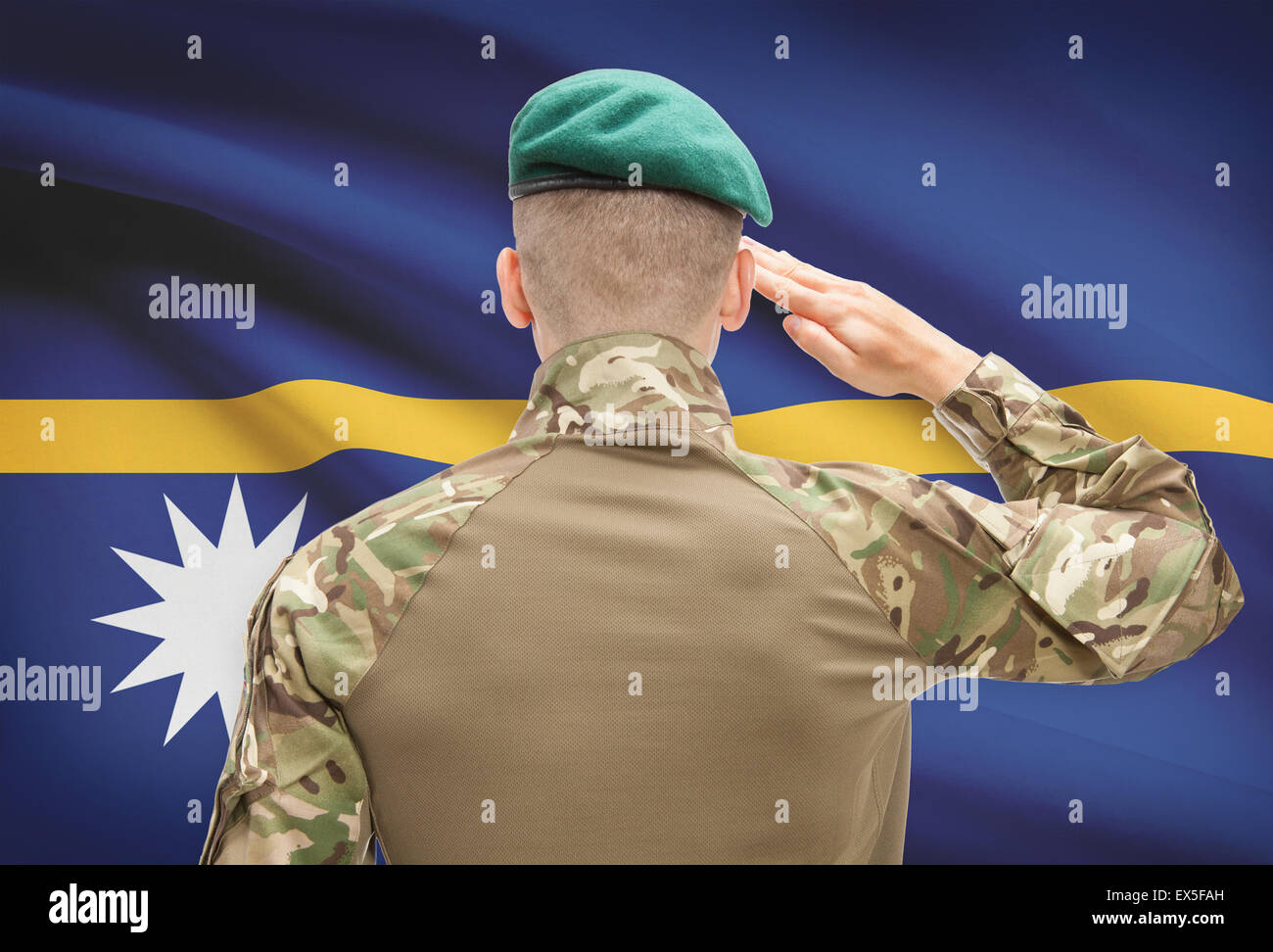 Soldier in hat facing national flag series - Nauru Stock Photo - Alamy