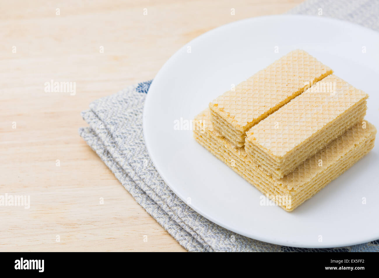 Wafer milk in white plate on the table Stock Photo - Alamy