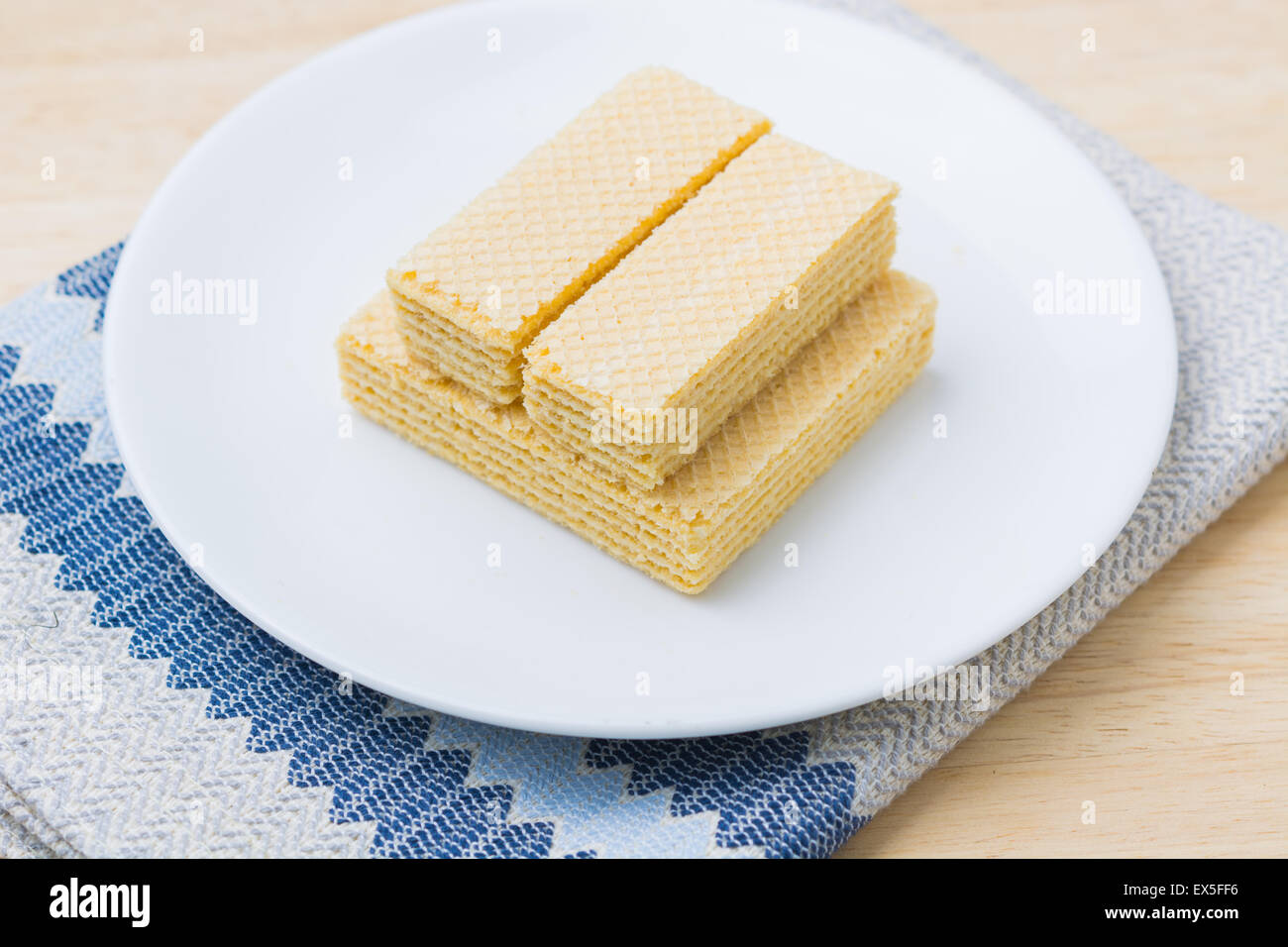 Wafer milk in white plate on the table Stock Photo - Alamy