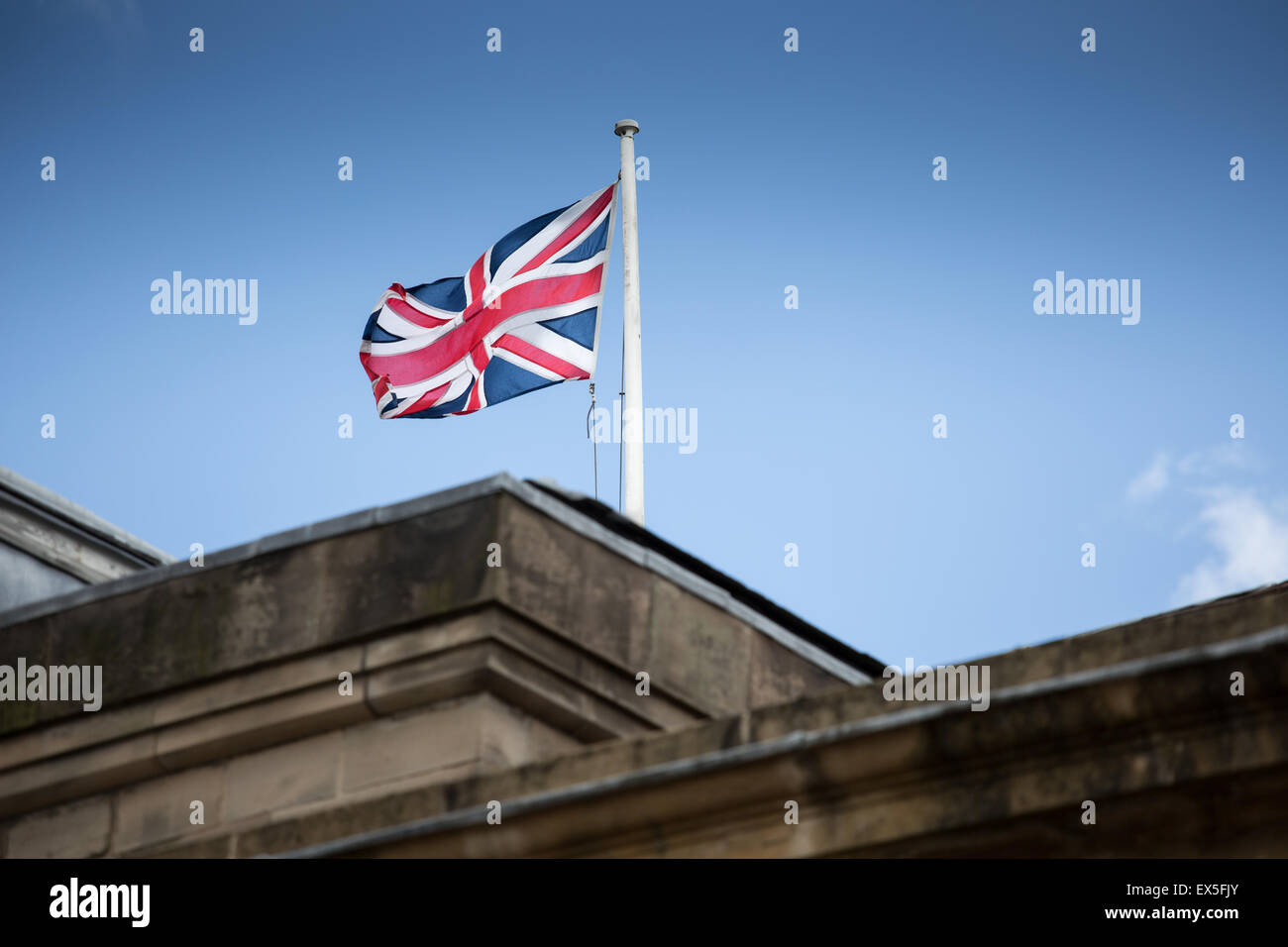 Union jack flag billowing against a dramatic sky Stock Photo - Alamy