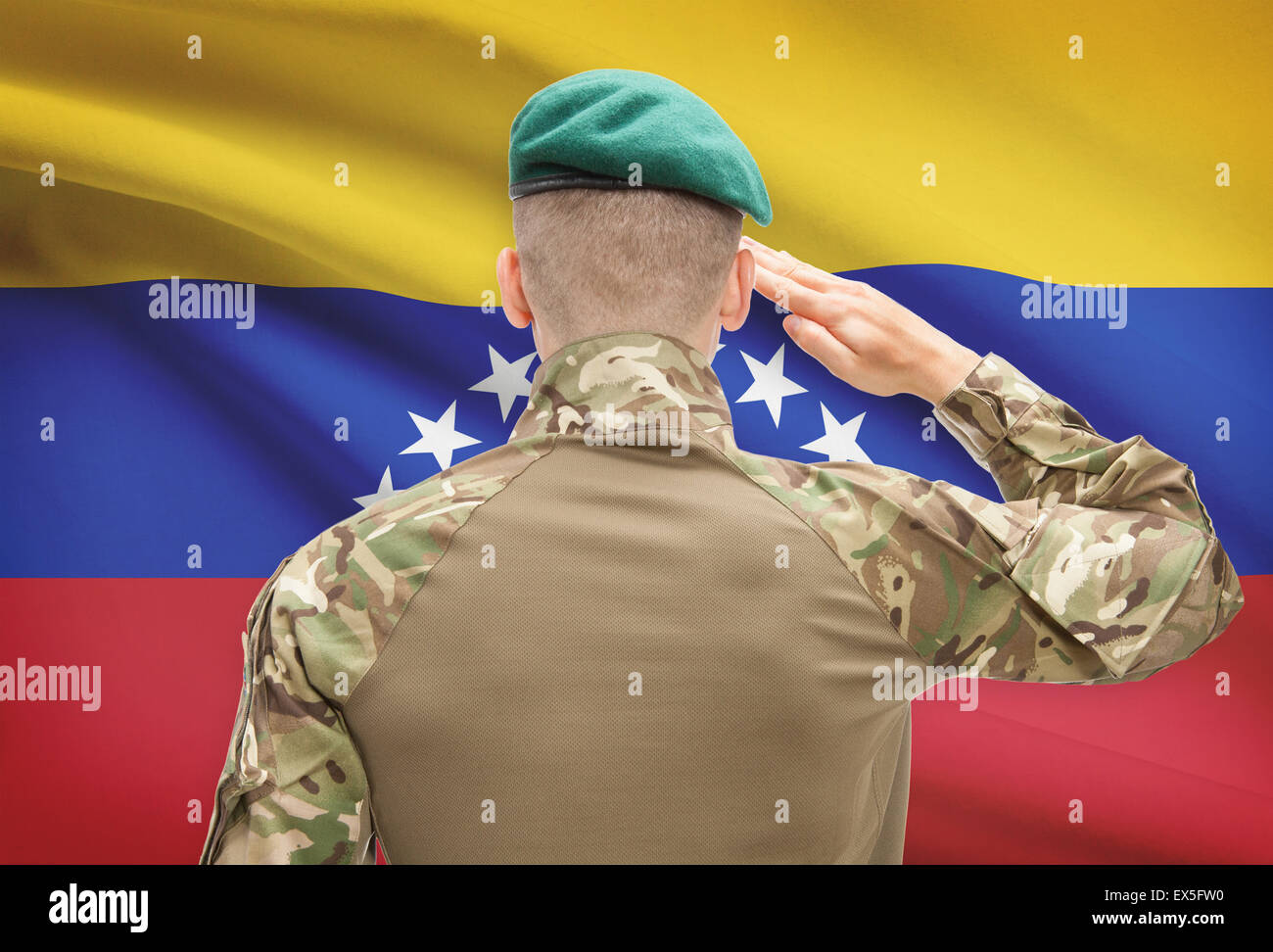 Soldier in hat facing national flag series - Venezuela Stock Photo - Alamy