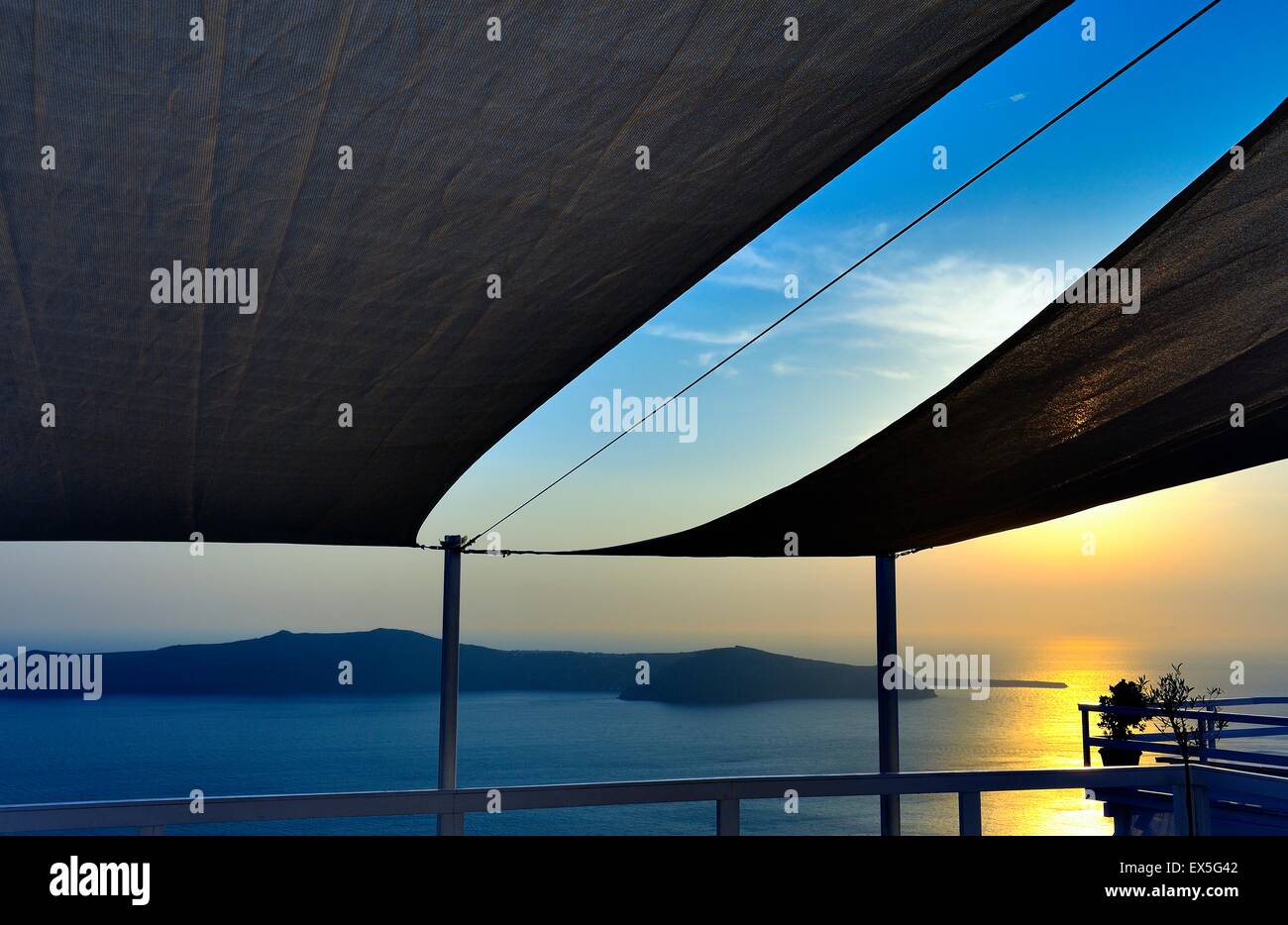 A sunset view from a hotel balcony in Santorini Greece Stock Photo - Alamy