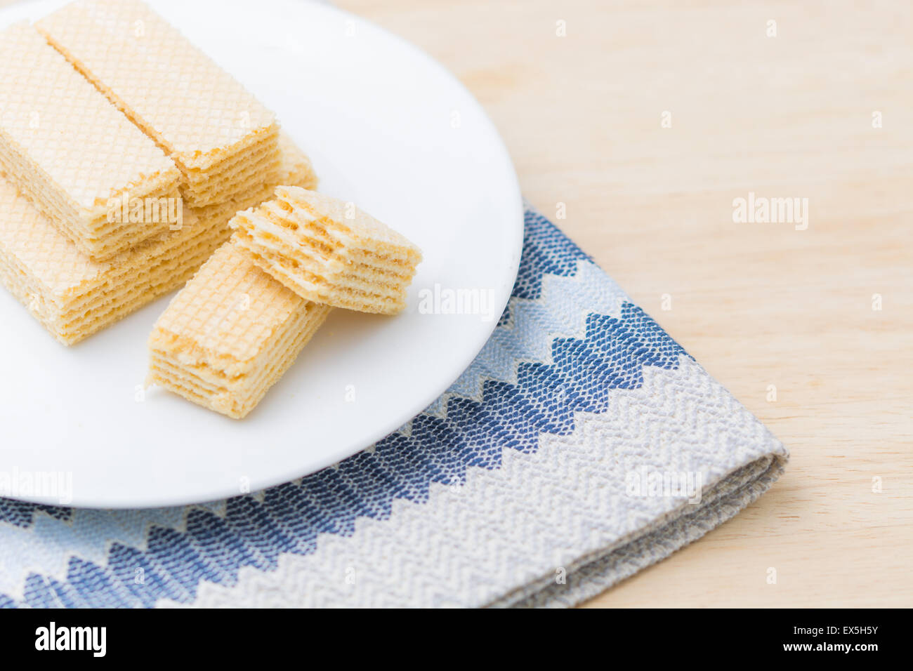 Wafer milk in white plate on the table Stock Photo - Alamy