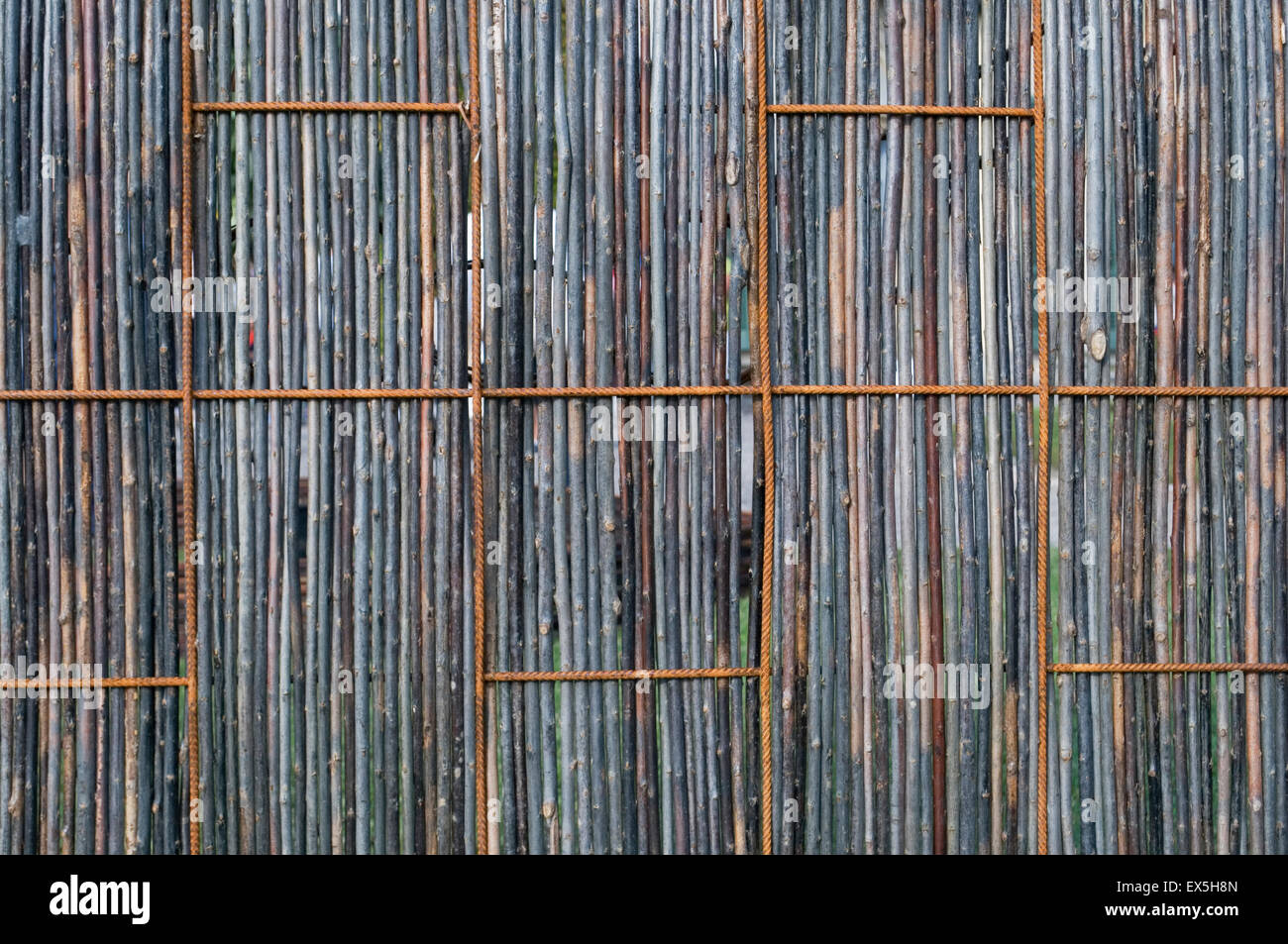 twigs fence with metal structure Stock Photo - Alamy