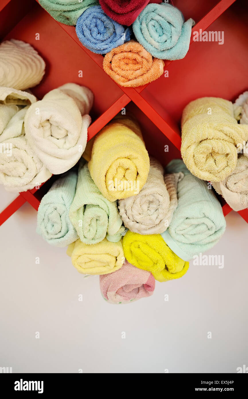 Stack of clean colorful bedding sheets and towels Stock Photo - Alamy