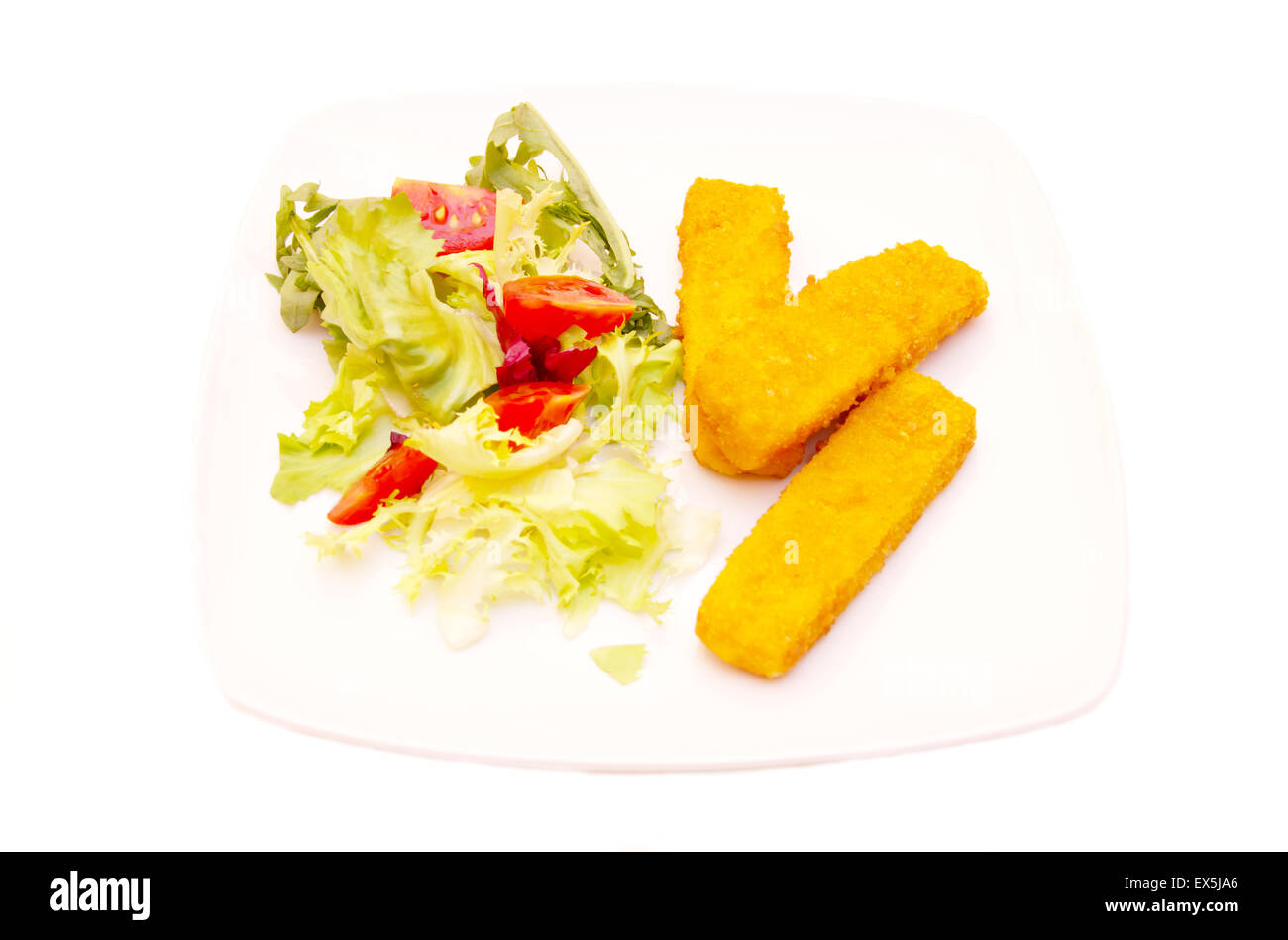 Fish fingers with salad on white background Stock Photo - Alamy
