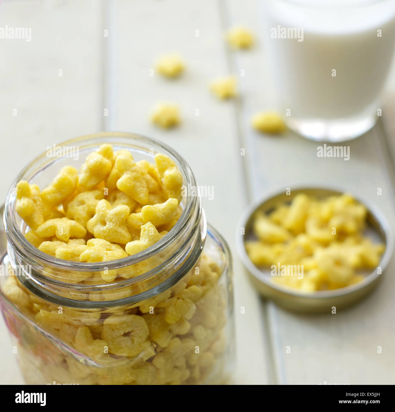 closeup sugar-coated corn flakes with milk background Stock Photo - Alamy