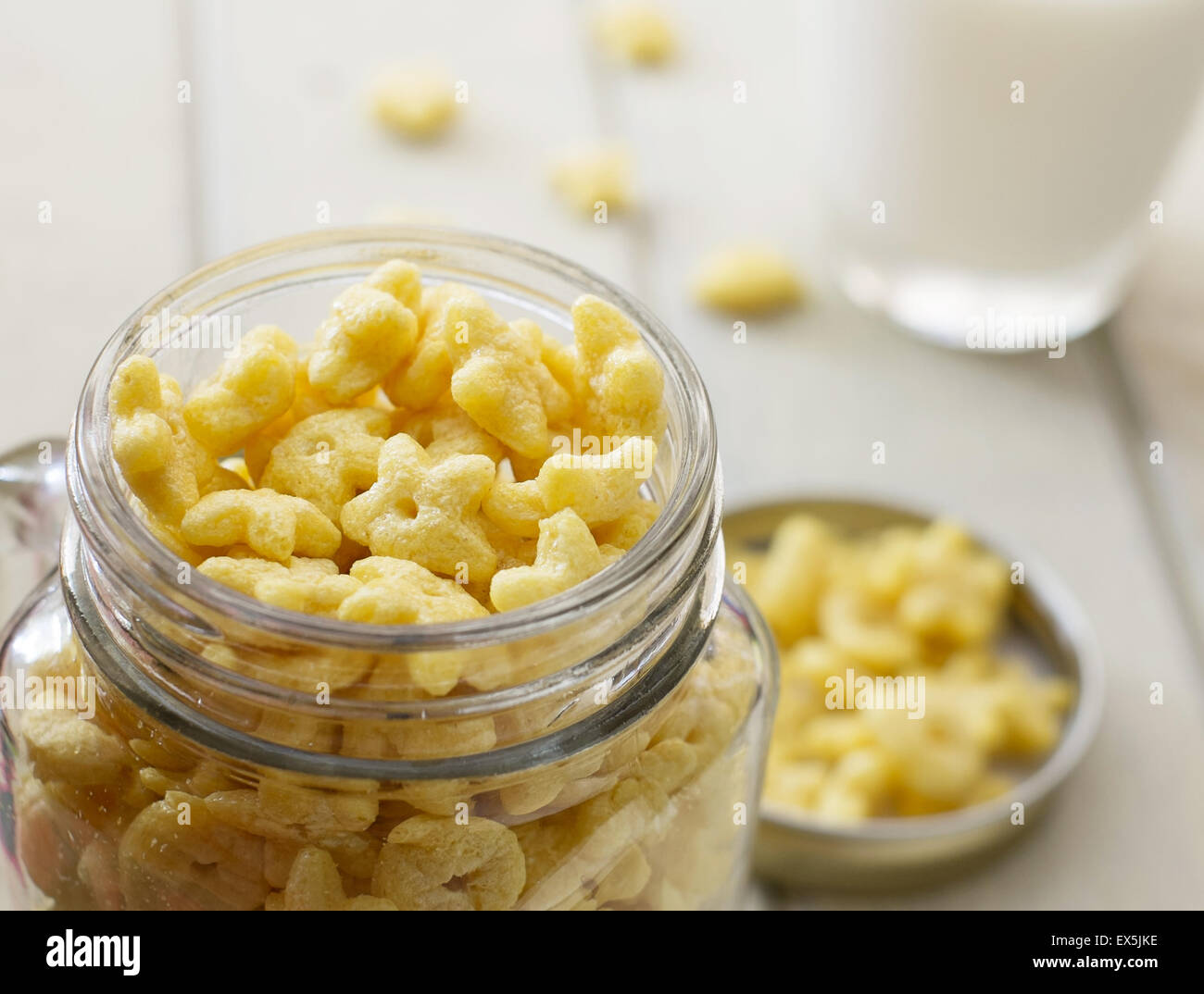 closeup sugar-coated corn flakes with milk background Stock Photo - Alamy