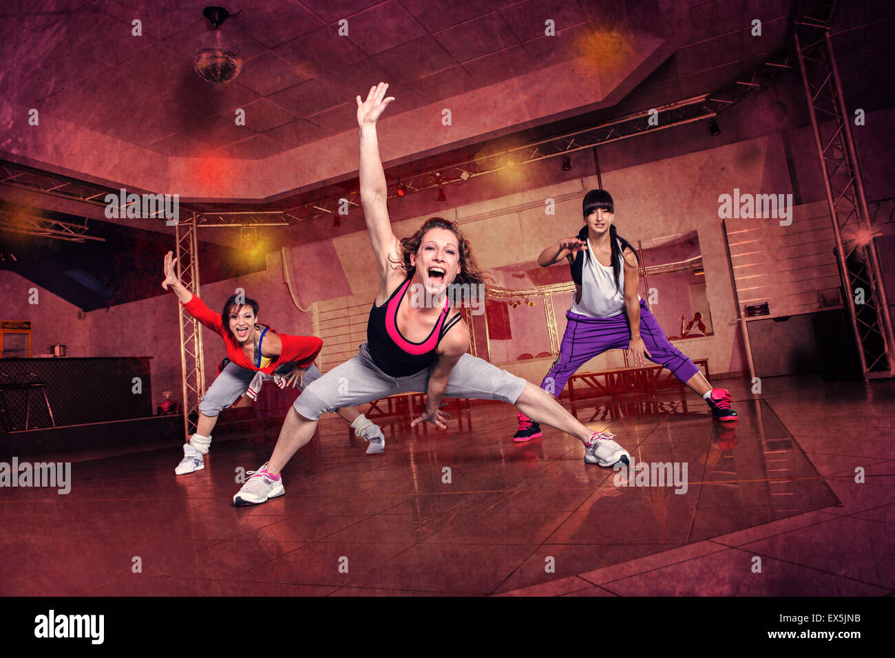 group of women in sport dress at fitness dance exercise or aerobics ...