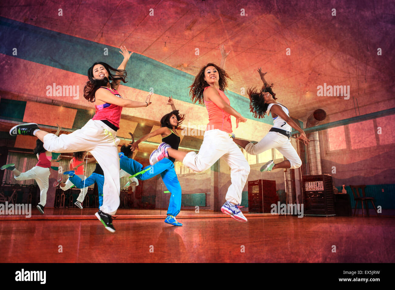 group of women in sport dress at fitness dance exercise or aerobics ...