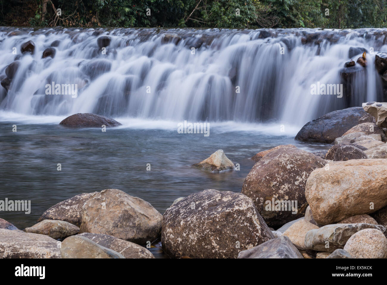 Dam handmade with stones A small river Stock Photo - Alamy
