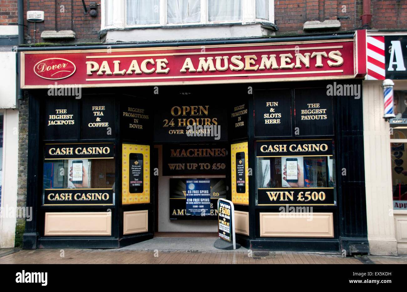 Run-down Main Street in seaside port town of Dover with shops closing ...
