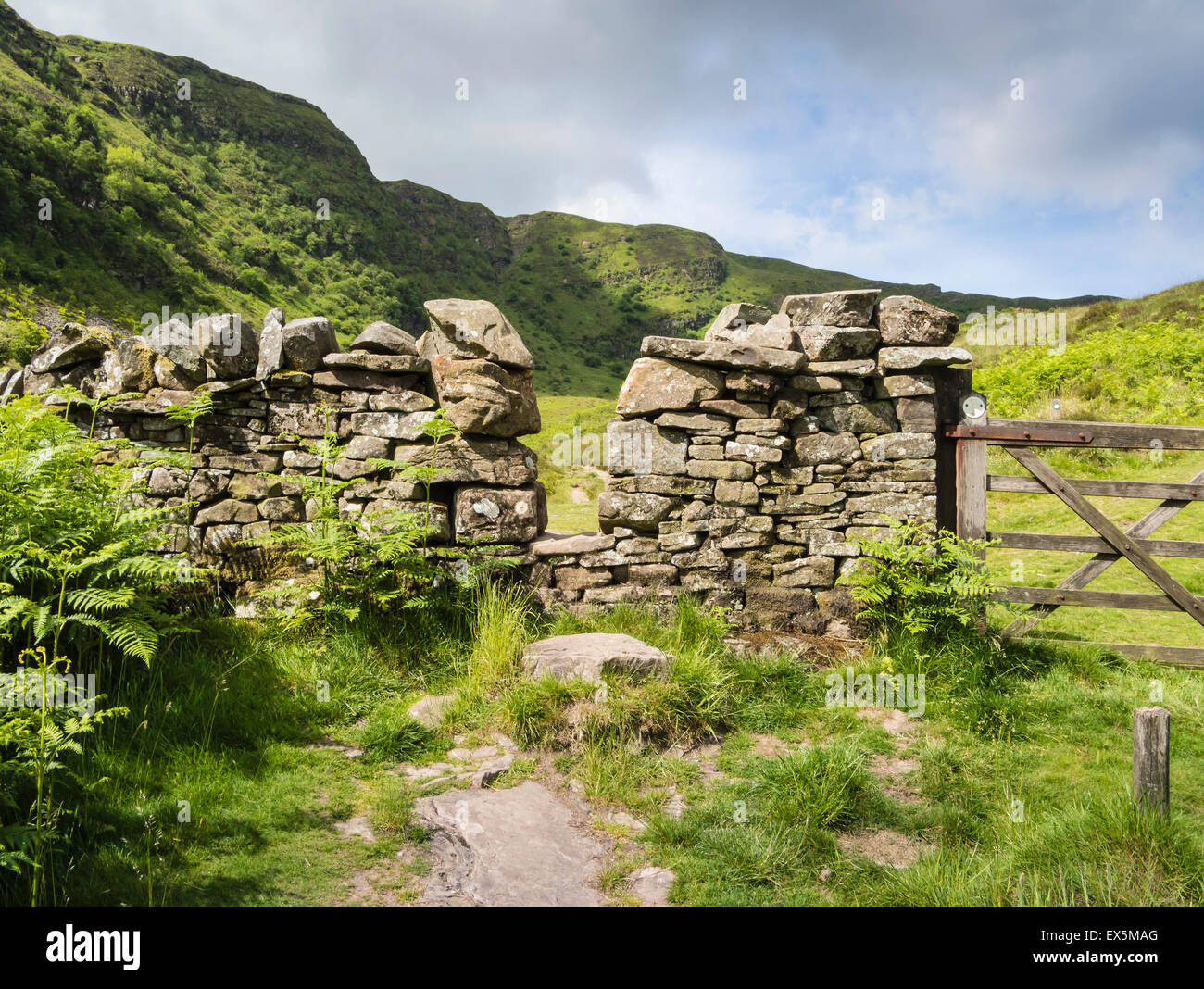 Stone wall and stile in a National Nature Reserve, Craig Cerrig ...