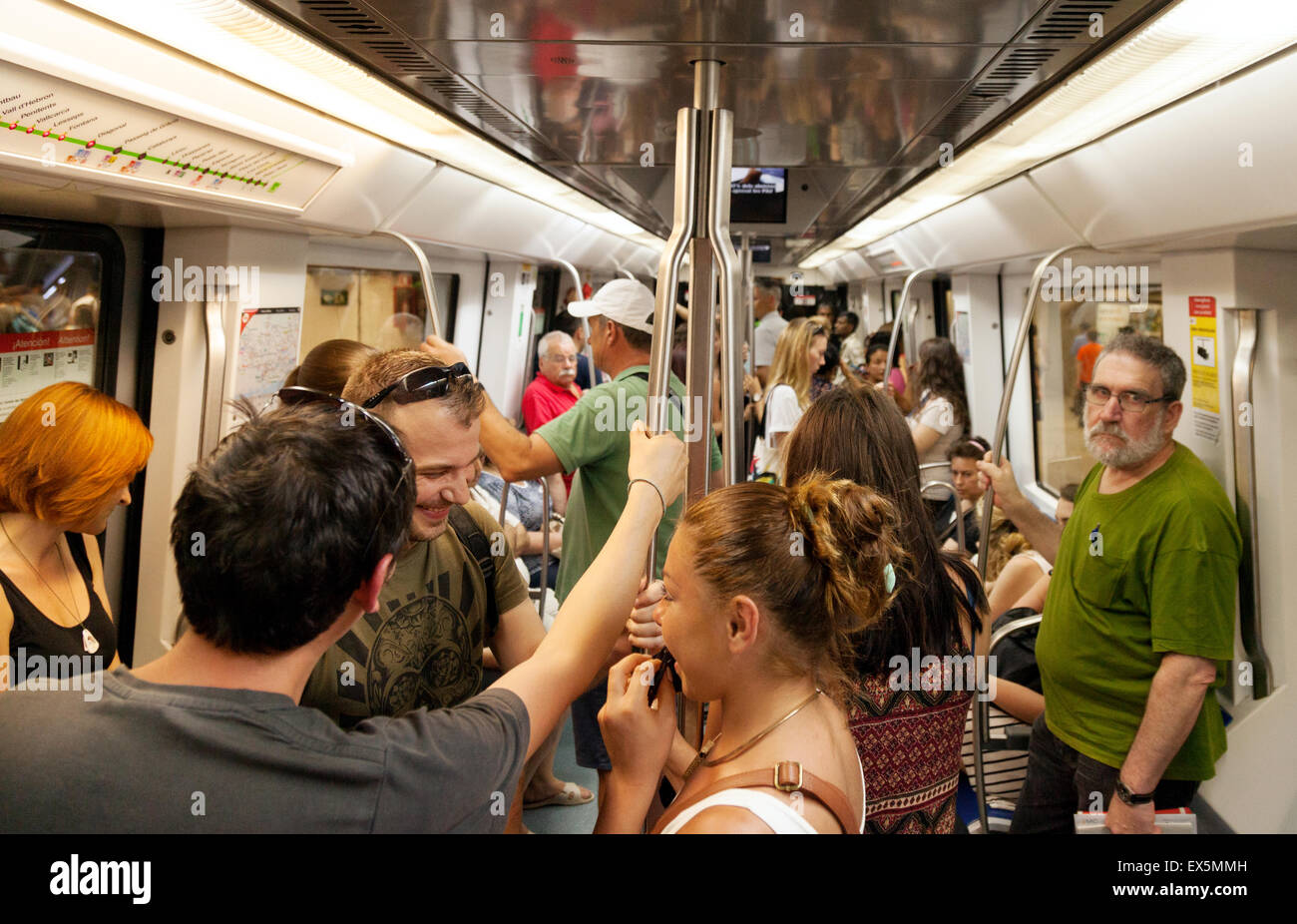 Local spanish people in a metro train carriage, Barcelona Metro ...