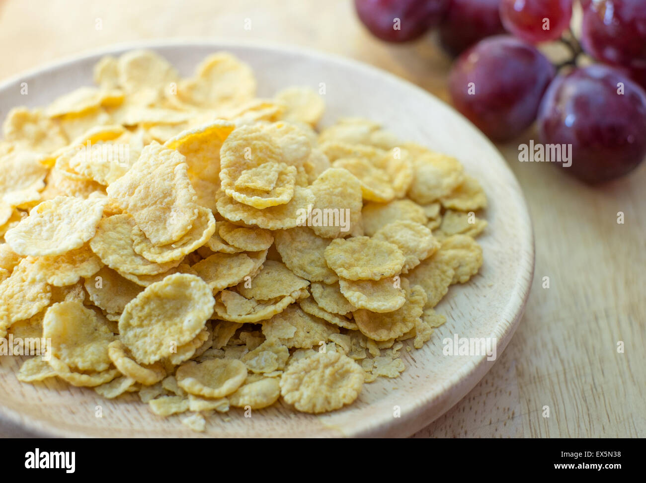 closeup sugar-coated corn flakes with grape background Stock Photo - Alamy
